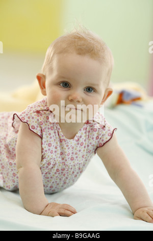Baby lying prone position arm portrait rest Stock Photo - Alamy