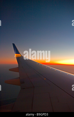 Airplane Wing at Sunset Stock Photo - Alamy