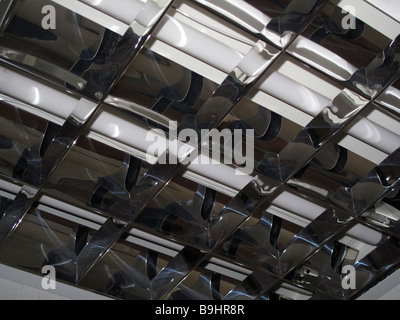 Fluorescent light fitting and tubes with reflectors to give maximum ...