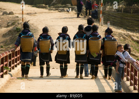 Black Hmong women and their baskets walking near Sapa Vietnam Stock ...