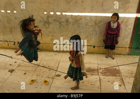 Black Hmong girls jumping rope in Sapa Vietnam Stock Photo - Alamy