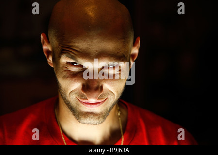 terrifying man with a grin as a smile looking at the camera with his ...