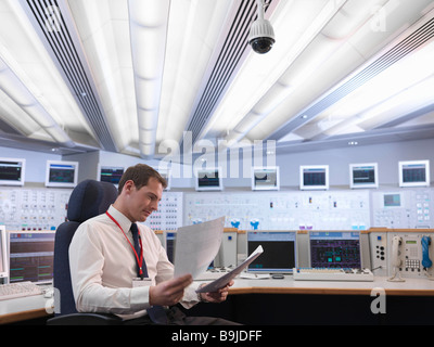 Operator in control room Stock Photo - Alamy