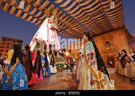 Spanish women wearing traditional clothes during the street procession ...