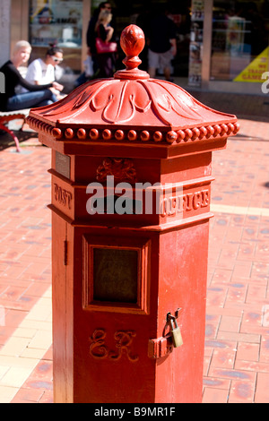 A red old fashioned letter box with a brick wall background Stock Photo ...