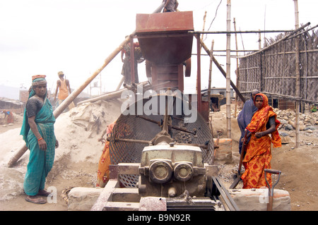 Women hard labor work danger job crush rock poverty Stock Photo - Alamy