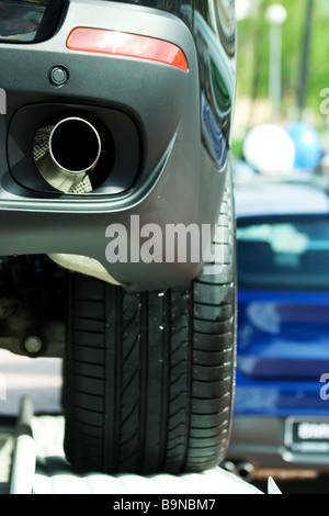 Exhaust pipe and back part of a car Stock Photo - Alamy