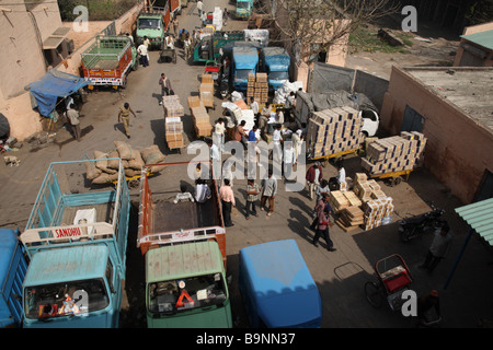Workers load a truck with goods at the station in Bunia, Congo, Monday ...