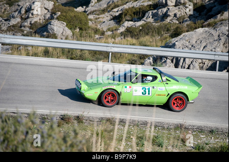 Green 1974 Lancia Stratos sports car racing in the Classic car rally ...