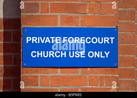 blue and white sign stating private forecourt church use only Stock ...