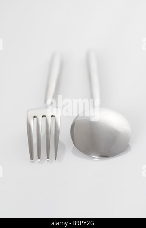 Closeup of silver forks and spoons on a black background Stock Photo ...