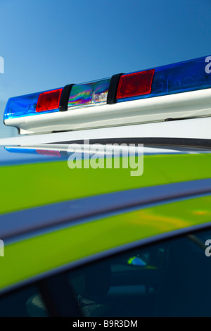 Police car with blue and yellow hi vis checkered livery Stock Photo - Alamy