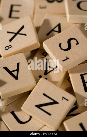Scrabble pieces with numerous different letters forming ABC Stock Photo ...