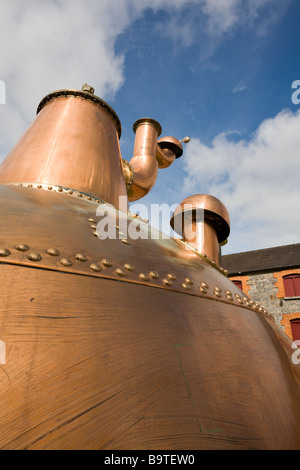 Copper Distilling Kettle. An old massive copper mash cooker is on ...