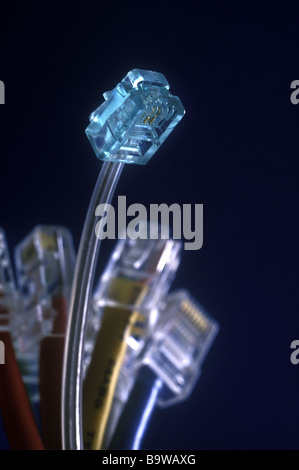 TELECOMMUNICATION COMPUTER CABLES ON PLAIN DARK BLUE BACKGROUND Stock ...