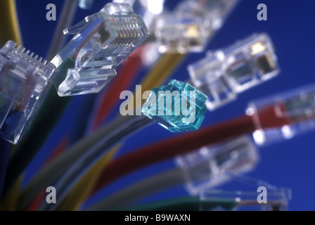 TELECOMMUNICATION COMPUTER CABLES ON PLAIN DARK BLUE BACKGROUND Stock ...