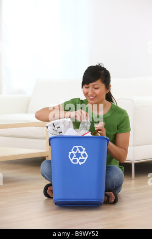 recycle recycling woman bin with glass bottles Stock Photo - Alamy