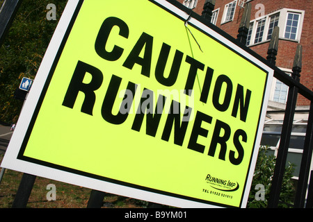 Caution runners sign Stock Photo - Alamy