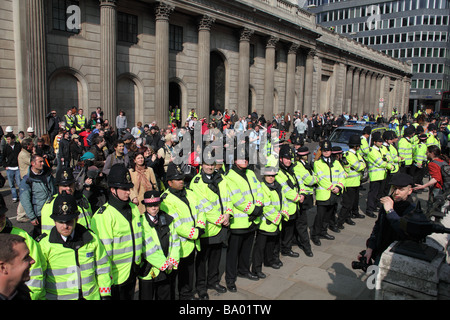 Protesters face police cordon outside the Bank of England during the ...