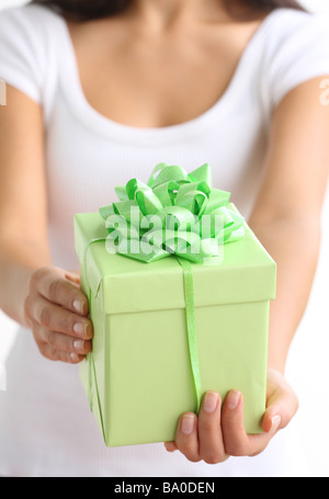 Present in hands Stock Photo - Alamy