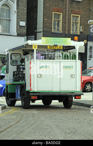 England UK Electric milk float on the cobbled street of a historic city ...