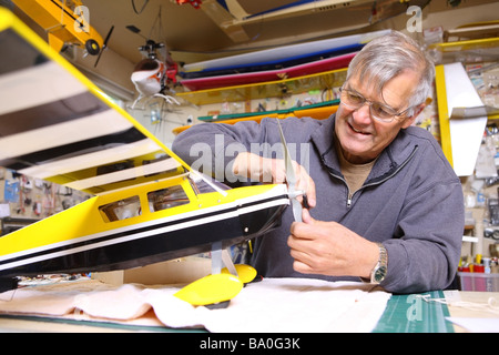 Man working on model airplane Stock Photo - Alamy
