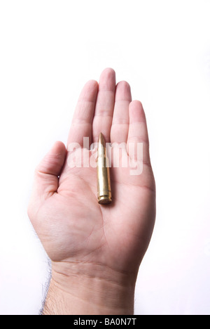Close-up of hand holding bullets Stock Photo - Alamy