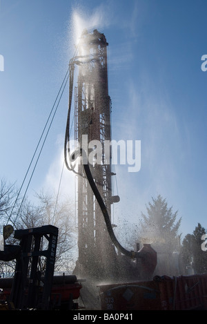 Tower and discharge hose for air rotary drilling rig with casing hammer ...