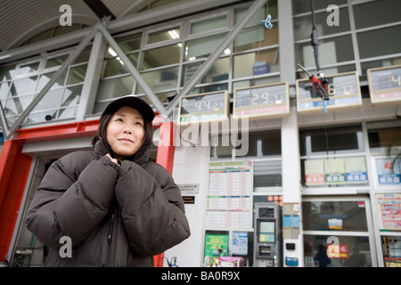 Gas station clerk wearing down jacket Stock Photo - Alamy