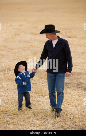 Father and son wearing cowboy hats Stock Photo: 23383686 - Alamy