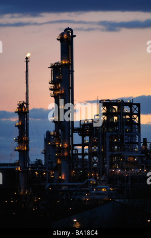 Smoke and flames billow from chimneys at the petrochemical refinery in ...