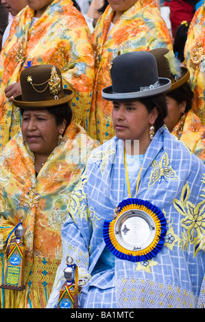 Two indigenous Bolivian women dressed in traditional clothing ...