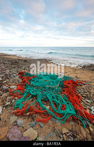 fishing nets,stones and debris, washed ashore on beach in Co.Cork ...