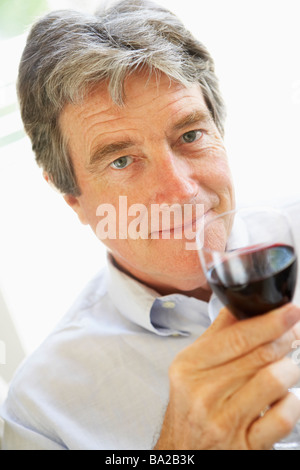 A vertical shot of glass of red wine on a white background.inverted ...