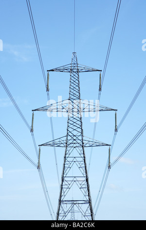 Power lines against blue sky Stock Photo - Alamy
