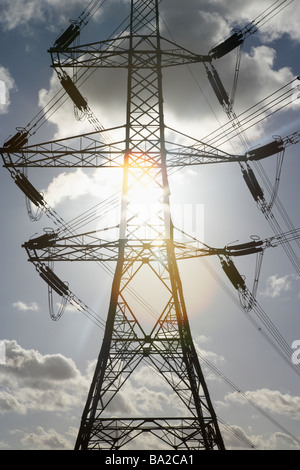 Electricity Pylon backlit with the sun. England, UK Stock Photo - Alamy