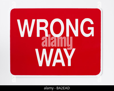 Red Wrong Way road sign on white background Stock Photo - Alamy