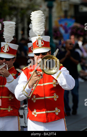 Trumpet player in red costume and mask celebrates the Feast of the Jews ...