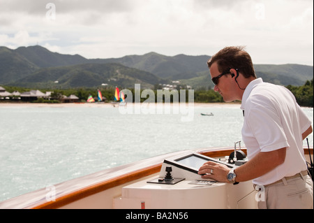 Captain on the bridge wing controls as superyacht "Big Aron Stock Photo ...