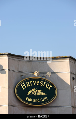 Harvester pub sign against a blue sky Stock Photo - Alamy
