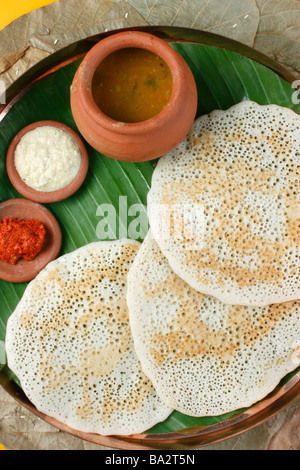 Set dosa is a set of 3dosas topped with butter or ghee and served with ...
