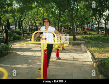 China Peking park fitness-appliance woman athletically summers trains ...