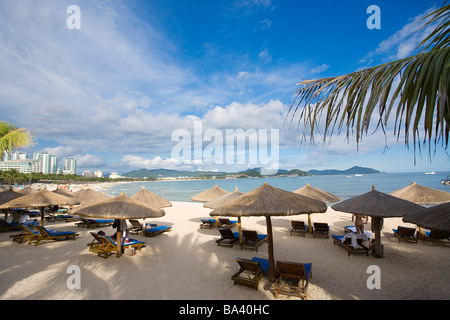 Beach chairs and umbrellas on beach Dadong Sea Hainan Province Stock ...