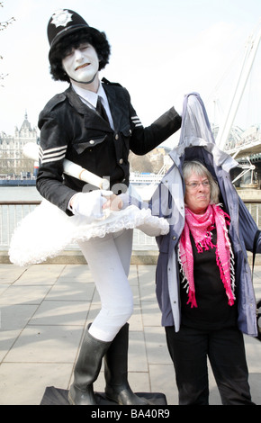 The South Bank , London , mime artist street entertainer busker dressed ...