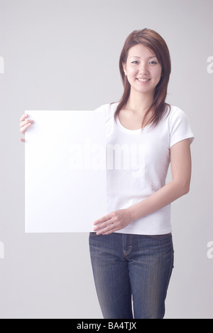 Japanese woman with a whiteboard smiling at camera Stock Photo - Alamy