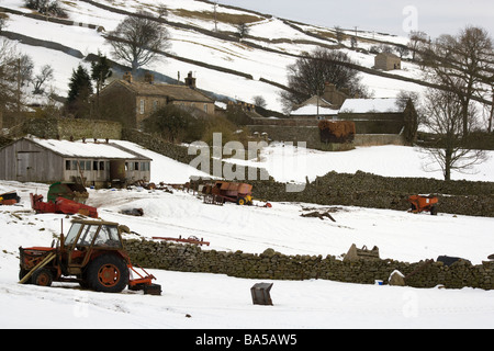 A farm and tractor at Healaugh in Swaledale North Yorkshire England UK ...
