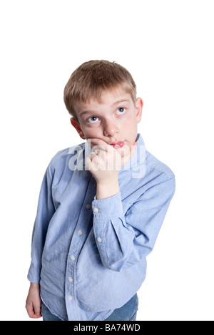 boy deep in thought isolated on white background in studio Stock Photo ...