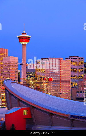 The Saddledome with high-rise buildings and the Calgary Tower in the ...