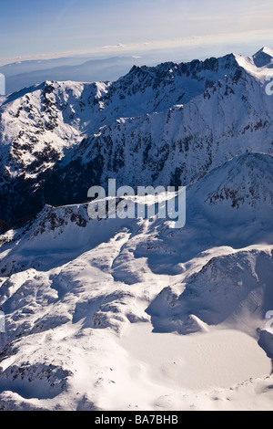 Scenic winter view of ski touring tracks on the snow-covered slopes of ...