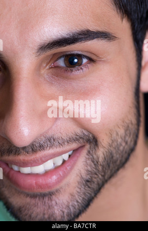 Smiling bearded ethnic man with crop girlfriend surfing internet on ...